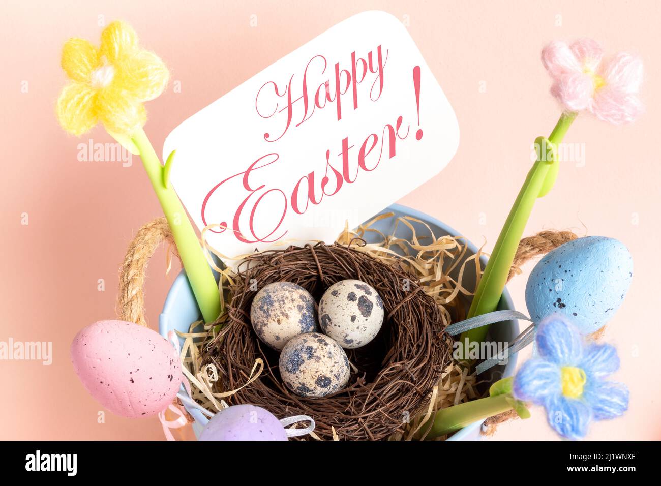 Easter card with festive decorations - nest of quail eggs, decorative ...