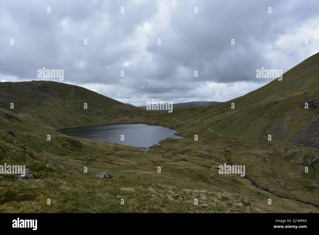 Scenic view looking down at Grisdale Tarn for the side of a fell Stock ...