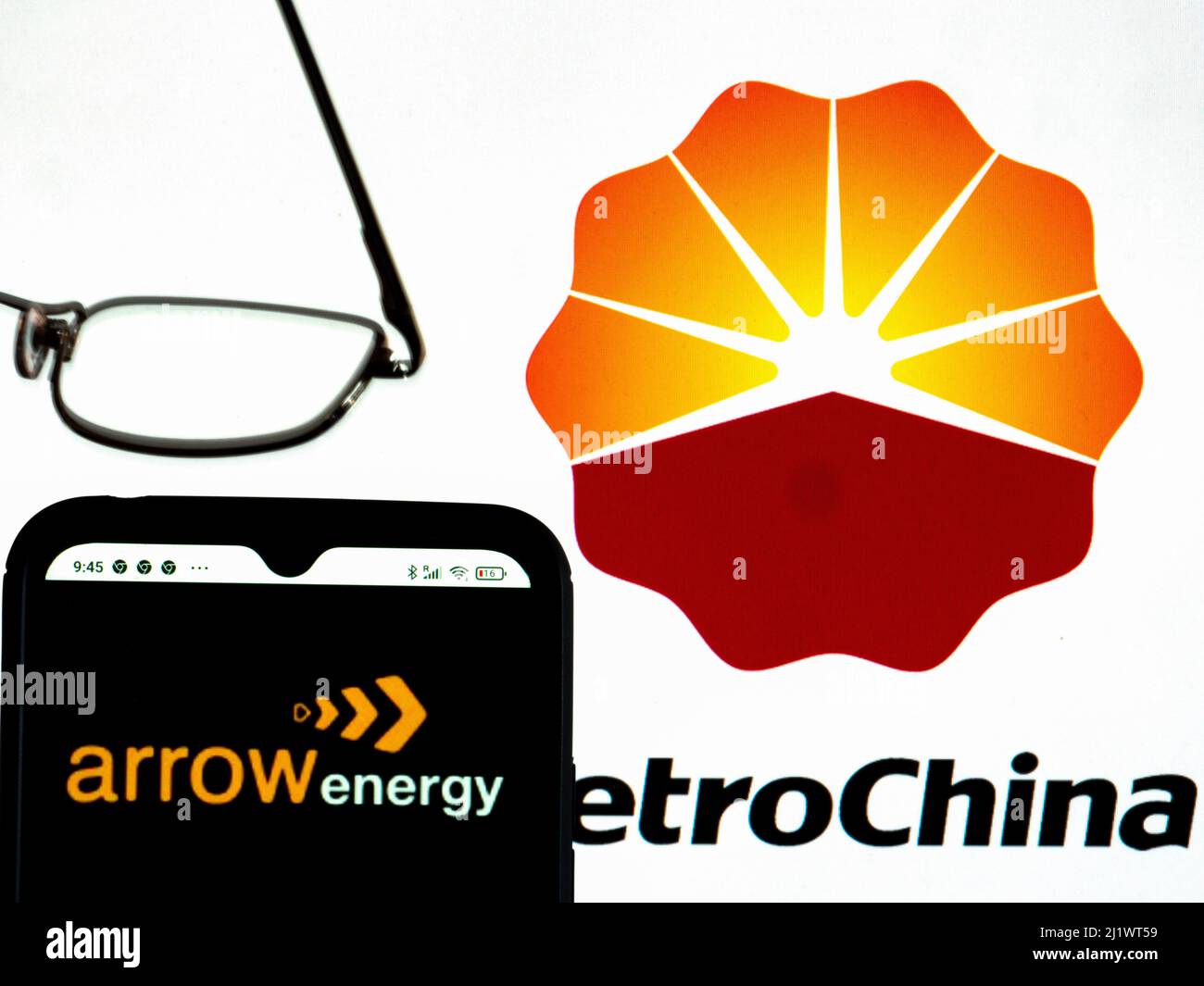 In this photo illustration, the Arrow Energy logo is displayed on a smartphone screen with a ...