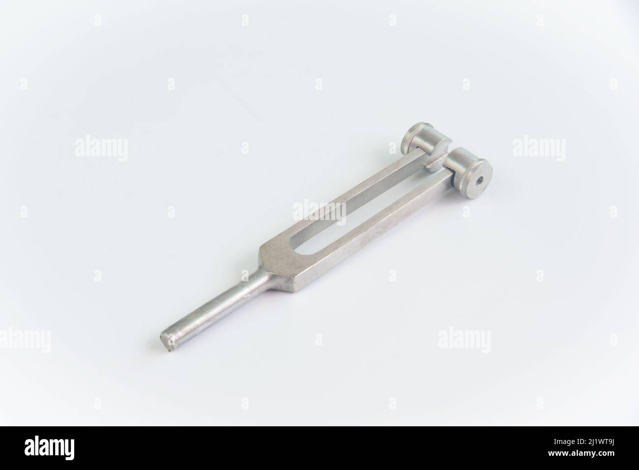 A tuning fork for neurokogical examination on white background Stock ...