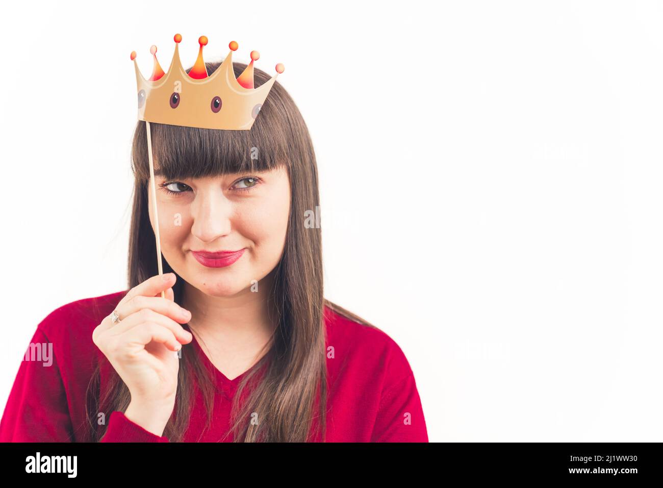 Studio portrait of pretty brown-haired caucasian woman wearing funny ...