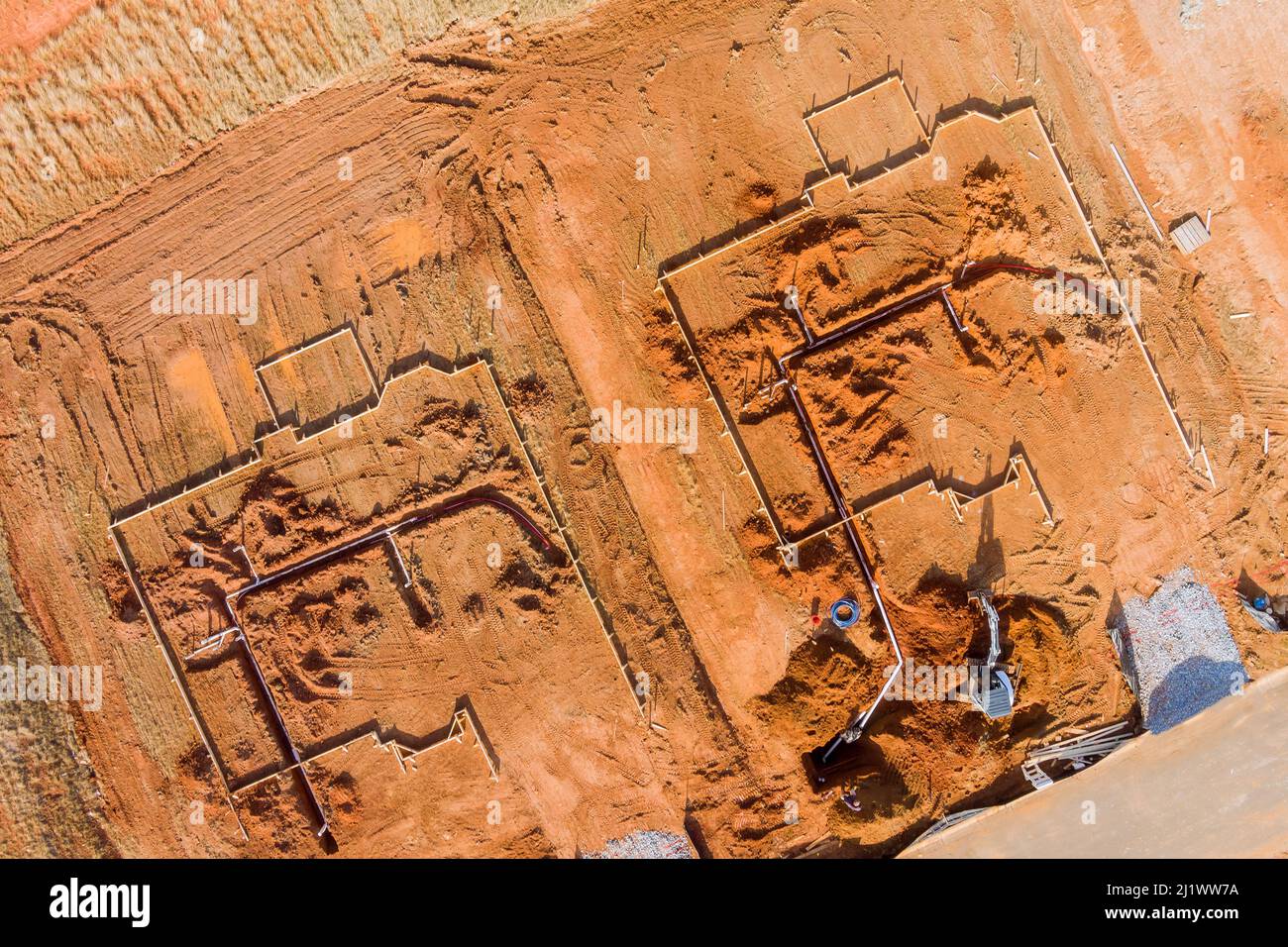 Aerial top layer pipes installation of underground utilities on water ...