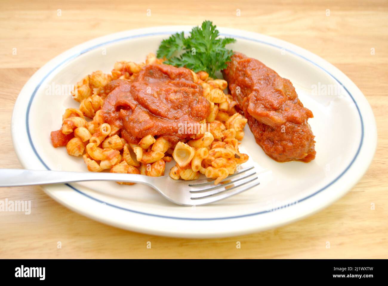 Shell and Elbow Pasta with Sauce and a Sausage on the Side Stock Photo ...