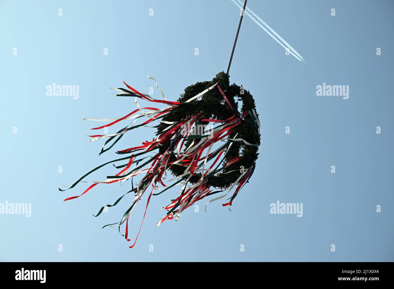 Willich, Germany. 28th Mar, 2022. The topping-out wreath hangs on a ...