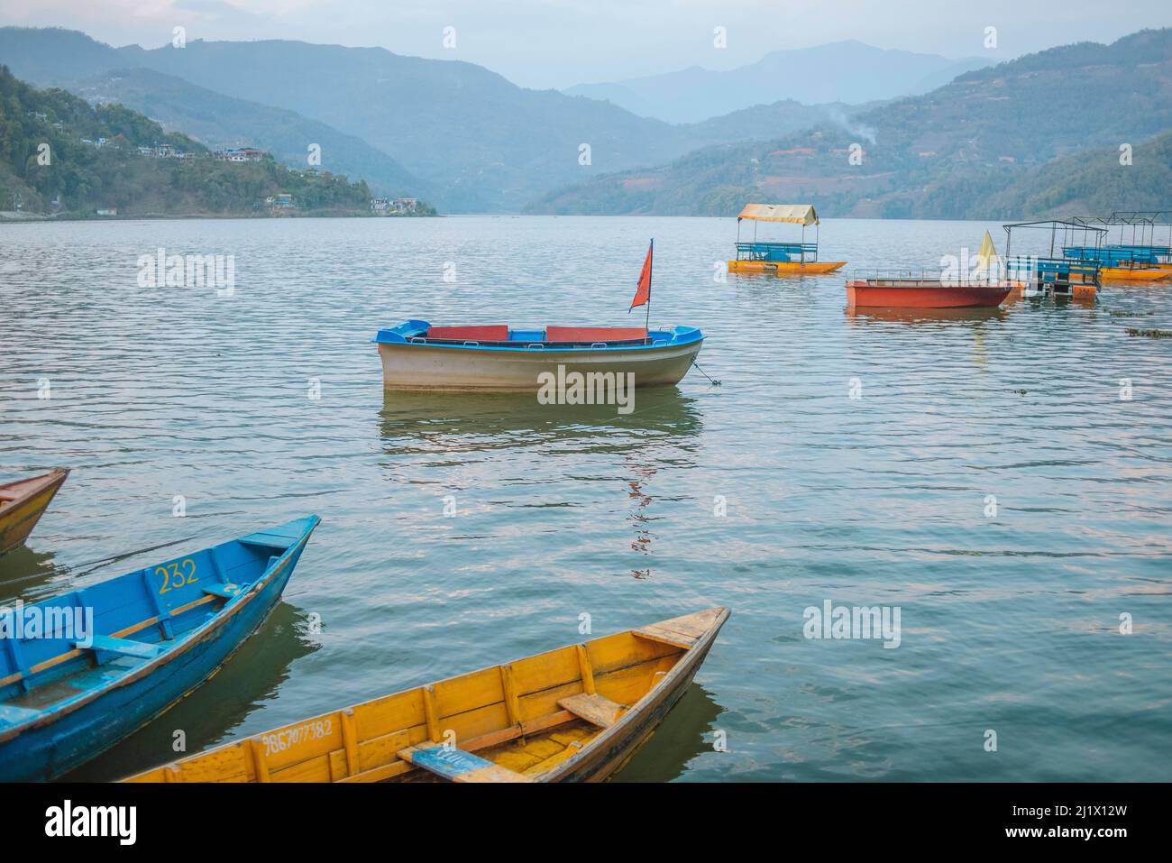 Boats at Begnas lake, Pokhara, Nepal Stock Photo - Alamy