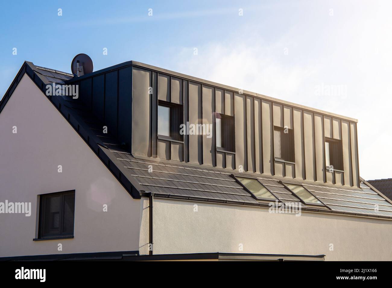 Newly tiled roof with large dormer with standing seam cladding Stock ...