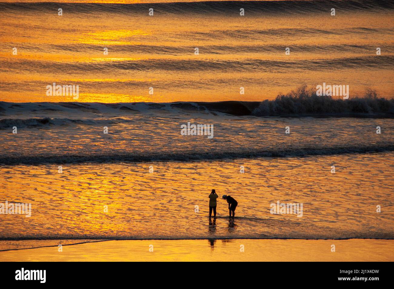 An amazing sunrise above the beach Stock Photo - Alamy