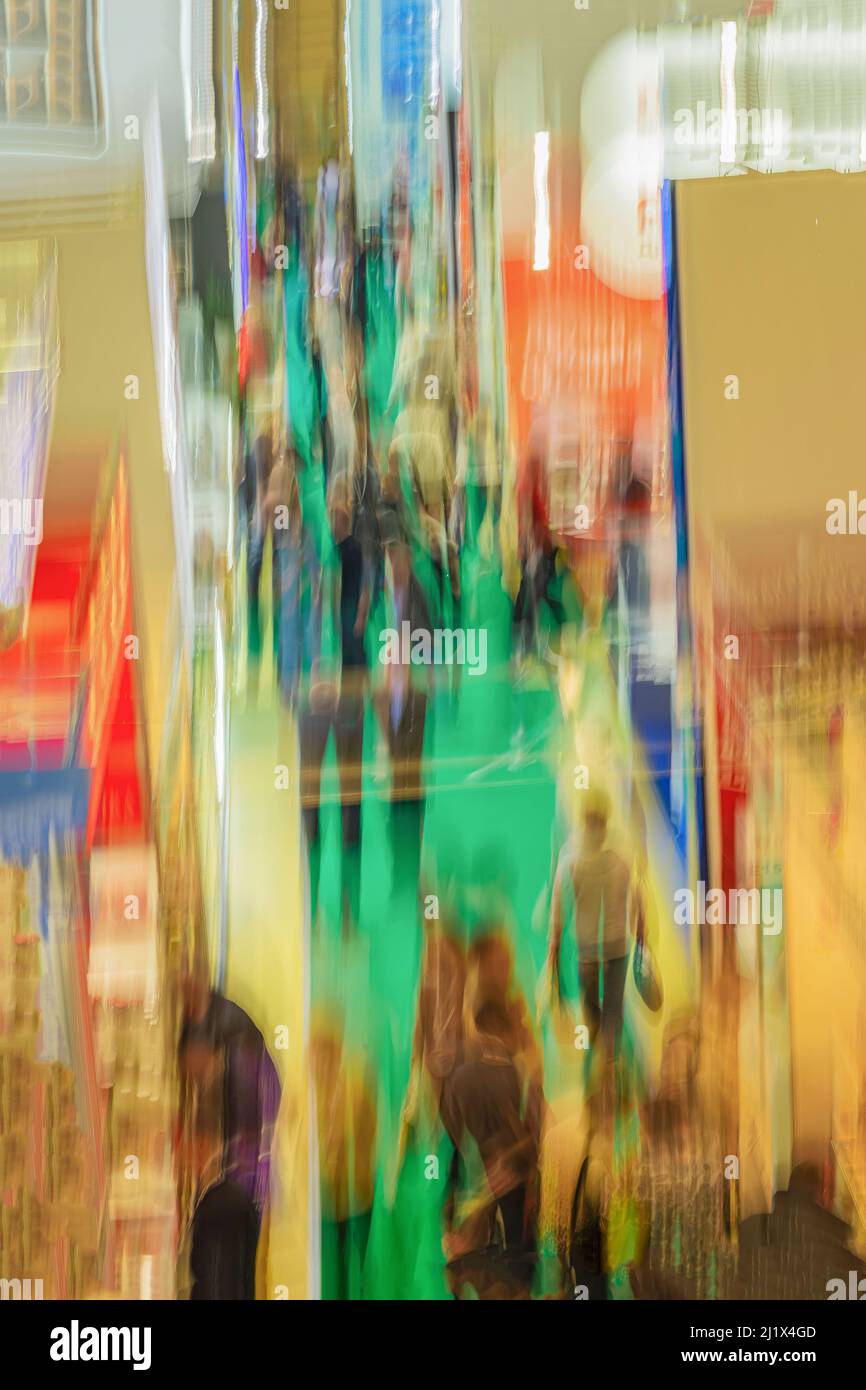 Abstract blurred event exhibition hall with people, business convention ...