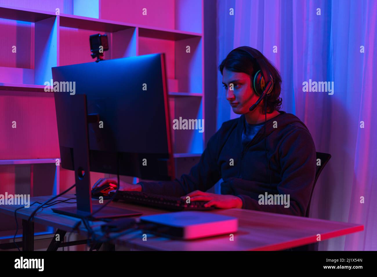 Game stream concept, Male streamer wear headset to play games online ...