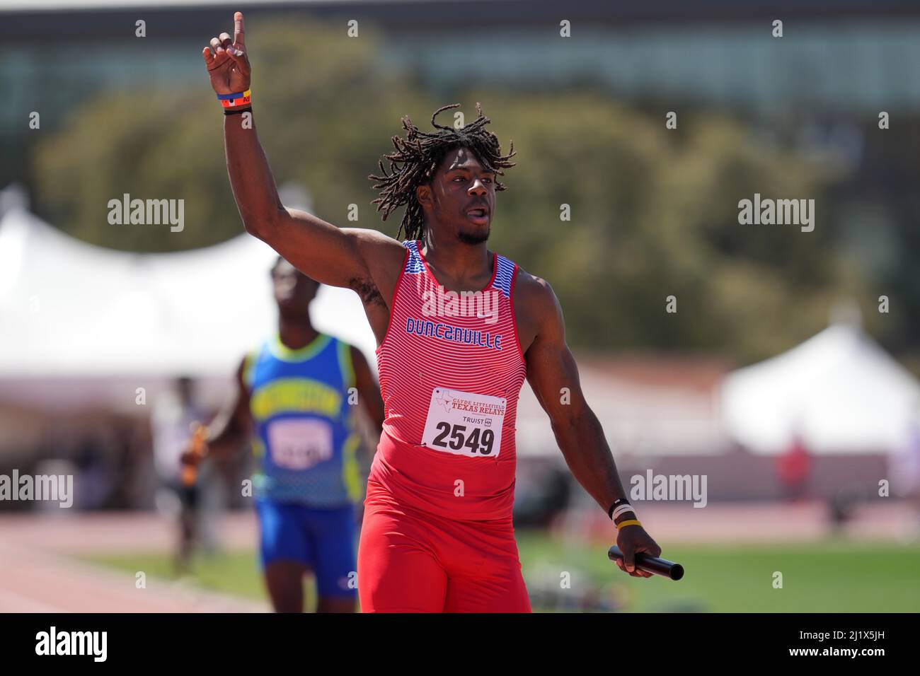Pierre Goree celebrates after running the anchor leg on the Duncanville ...