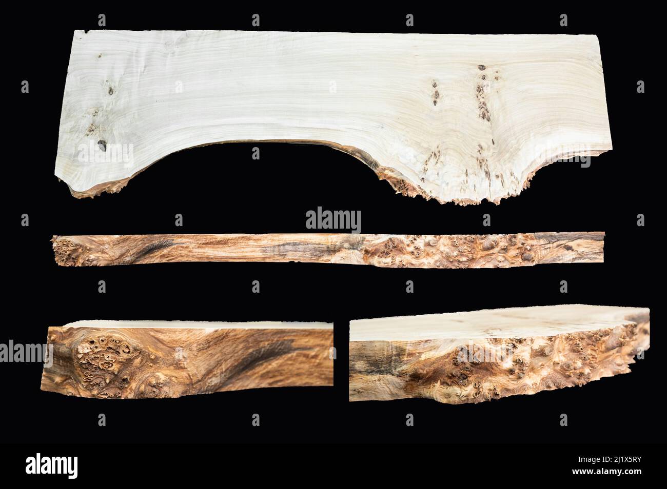 Pieces of wood isolated on black background. Texture of a polished cut ...