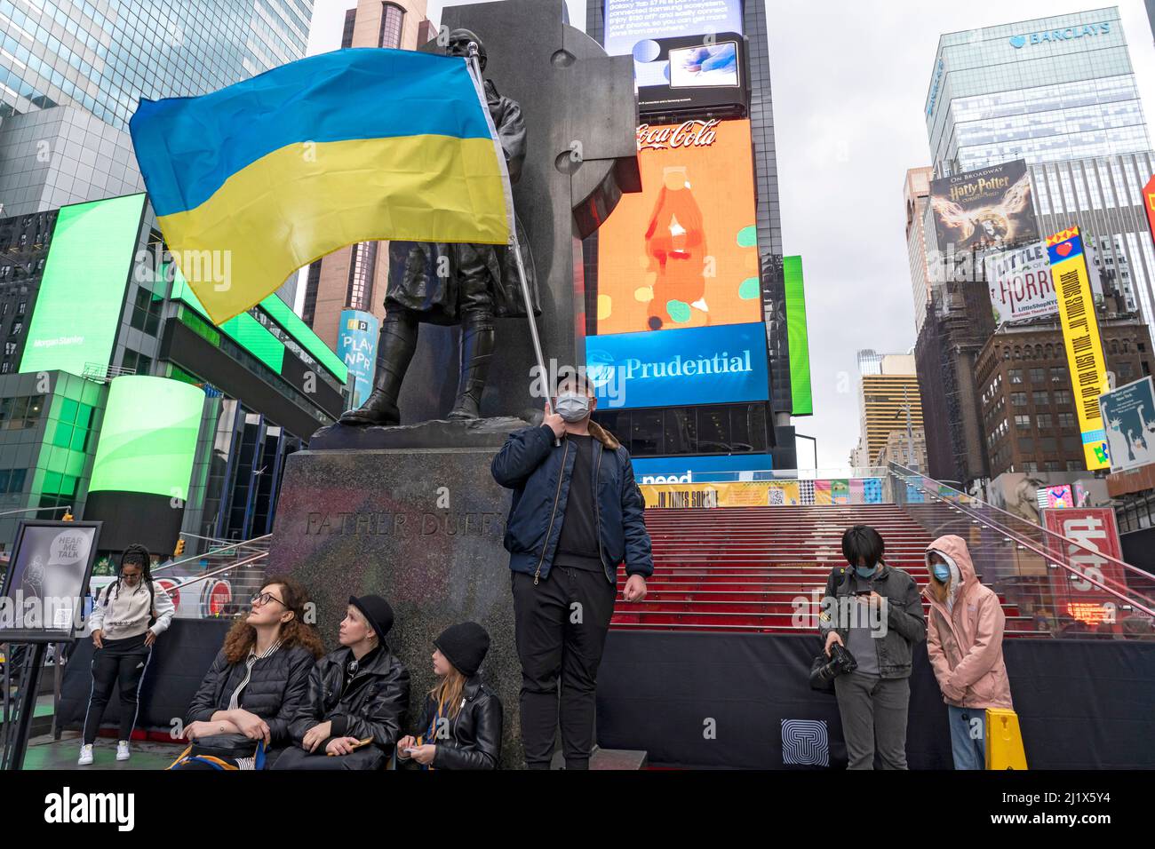 New York, United States. 26th Mar, 2022. A man holds Ukrainian flag at ...
