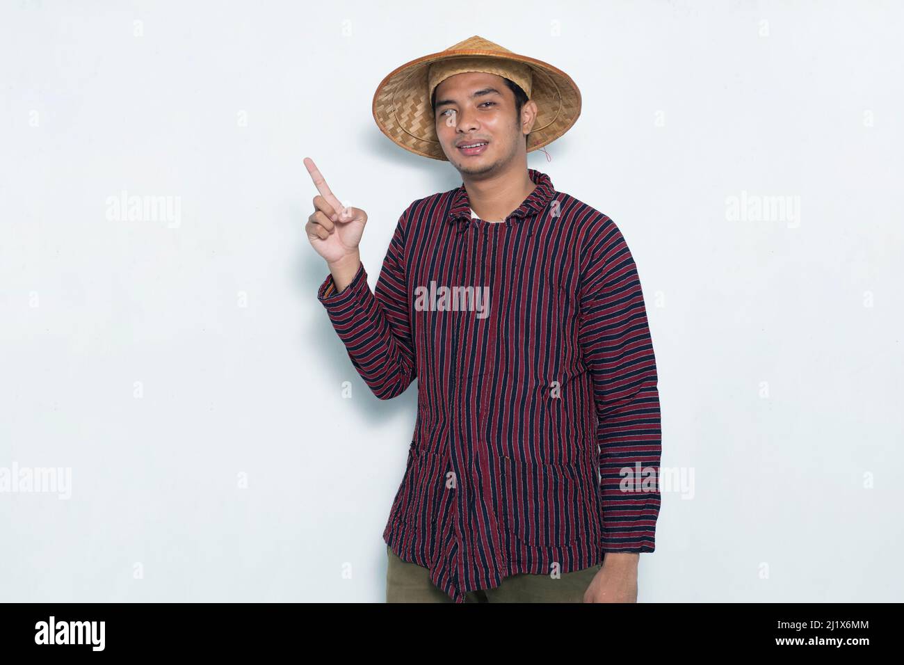 happy asian farmer pointing with fingers to different directions ...