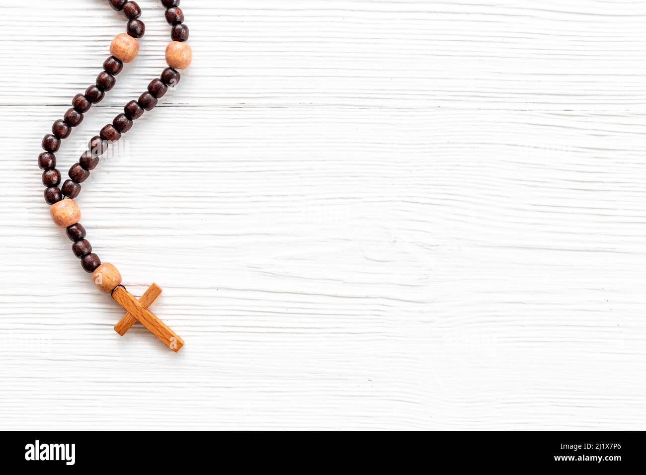 Wooden rosary beads with cross, top view. Christian concept Stock Photo ...