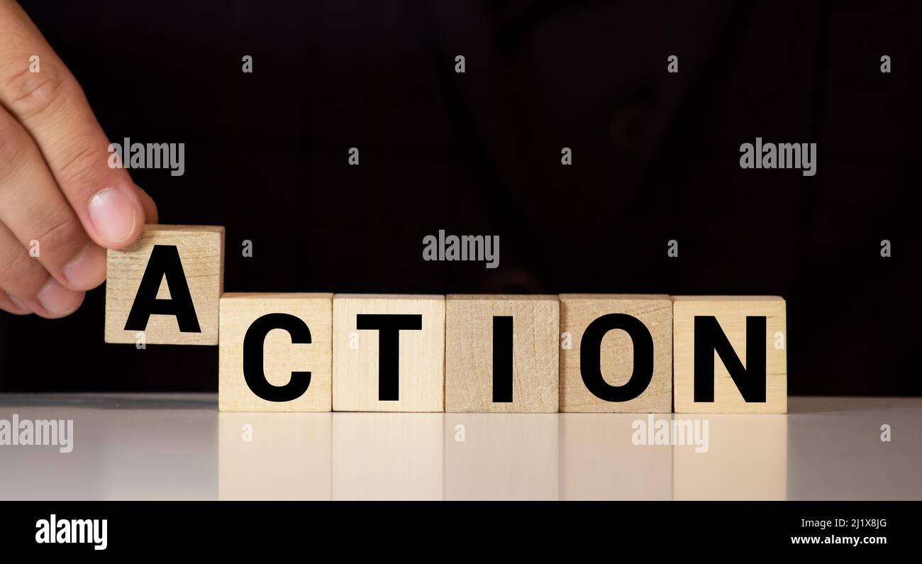 Action word written on wood block. Action text on table, concept Stock ...