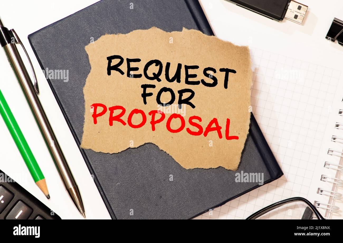 Request for proposal text on brown envelope Stock Photo - Alamy