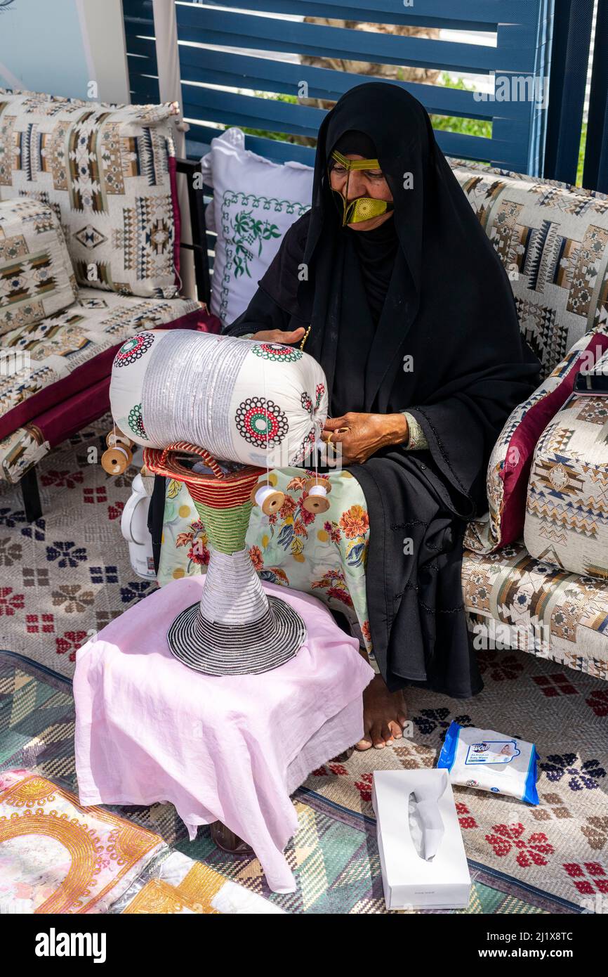 Muslim woman from UAE is doing traditional talli Stock Photo - Alamy