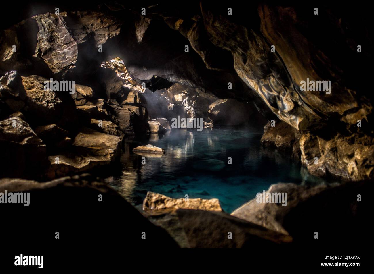a photo of small pond in cave Stock Photo - Alamy