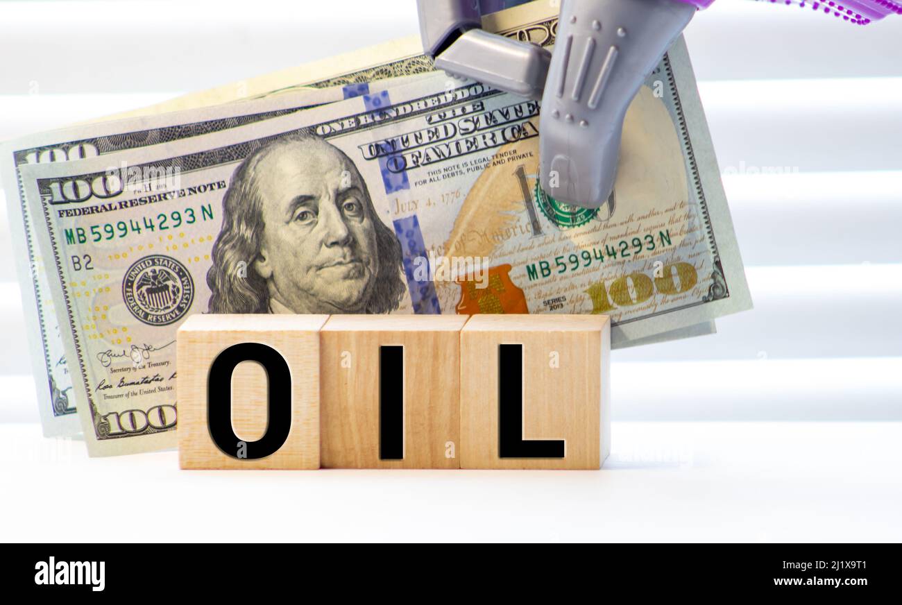 word Oil written with wood cubes, black background, top view Stock ...