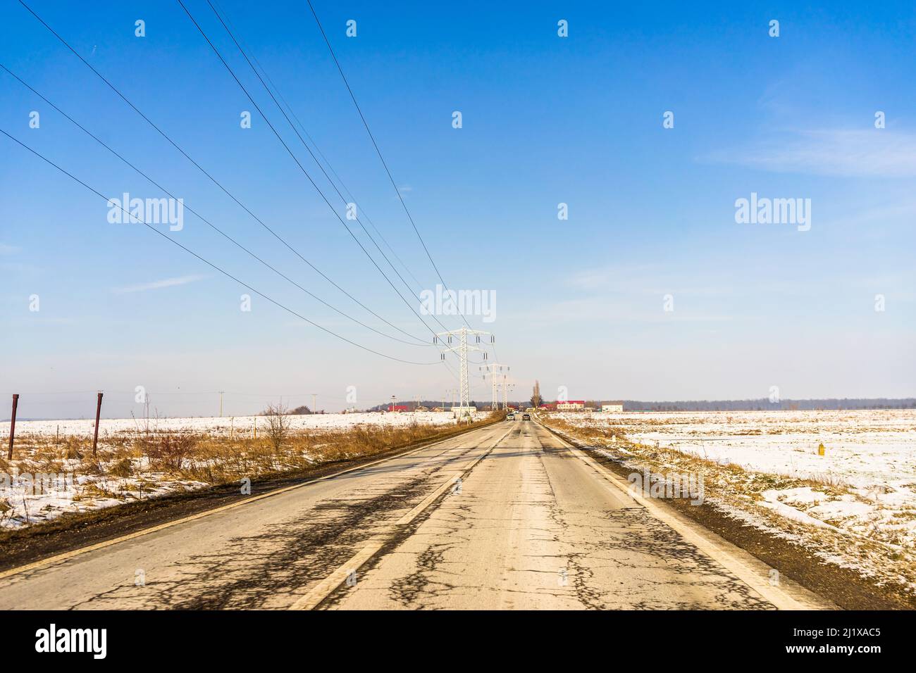 Winter season, view of cars and snowy street through windshield while ...