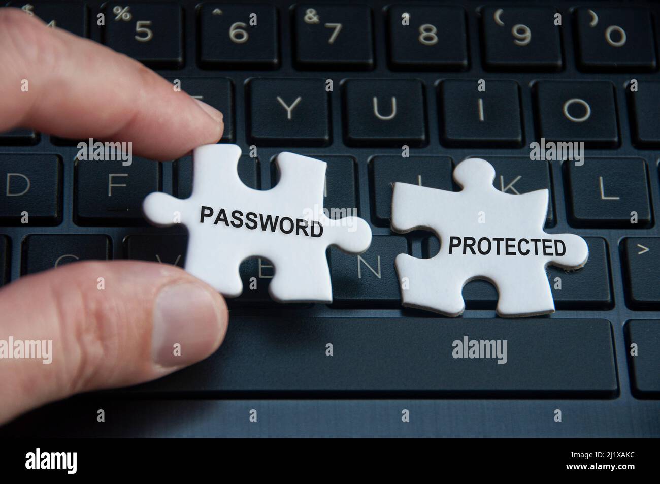 Password text on missing jigsaw puzzle with laptop and hand background ...