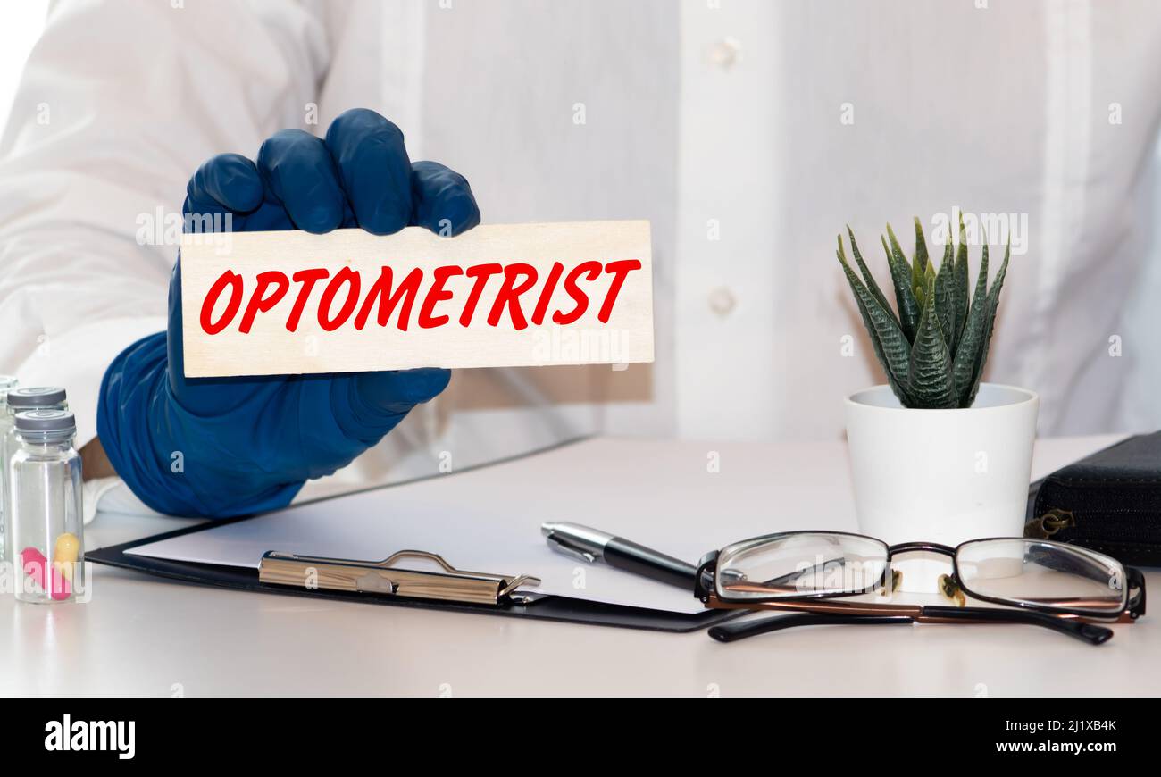 Name plate on a desk with the engraving optometrist Stock Photo - Alamy