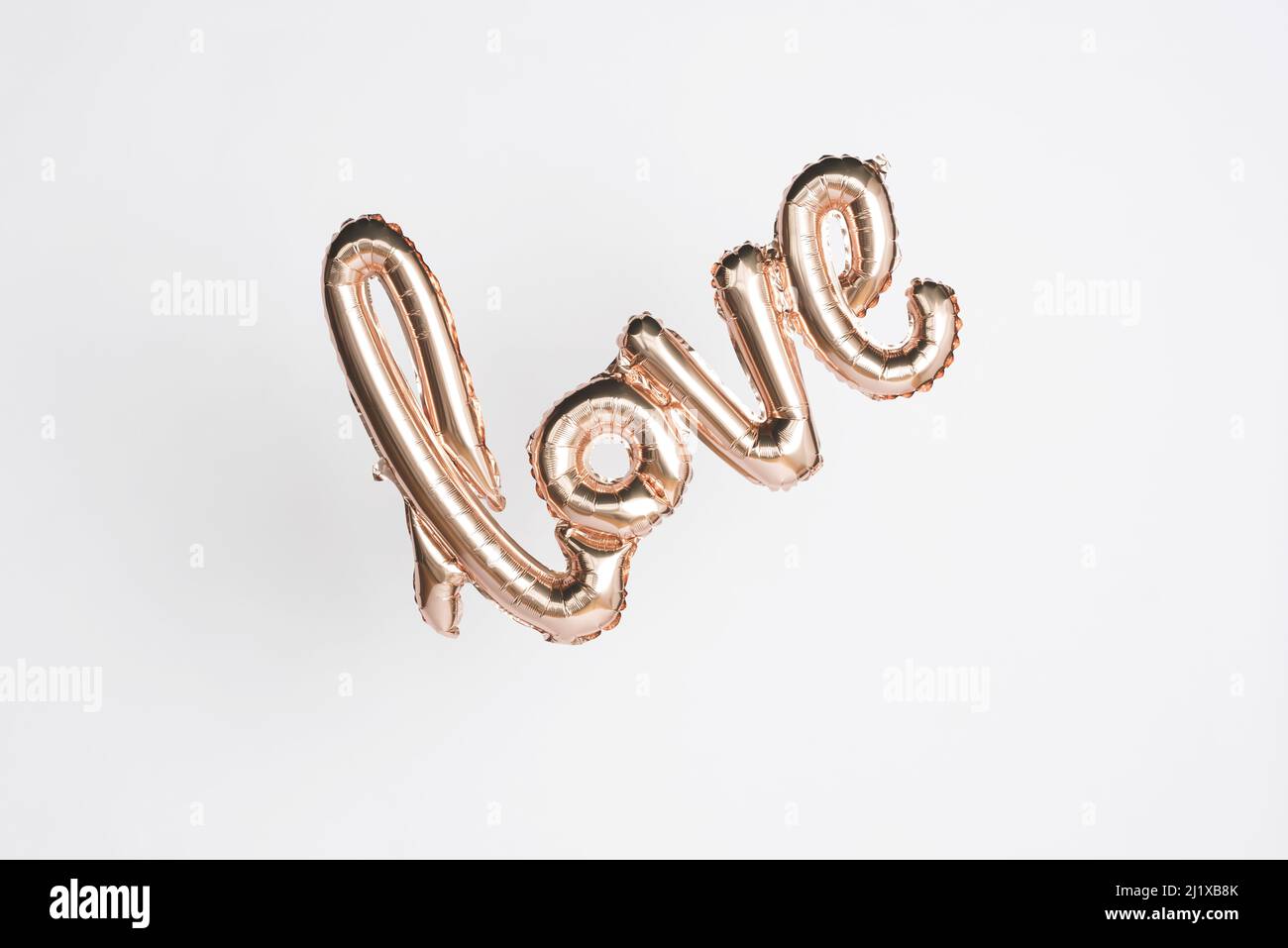 The gold metallic text Love balloons Stock Photo - Alamy