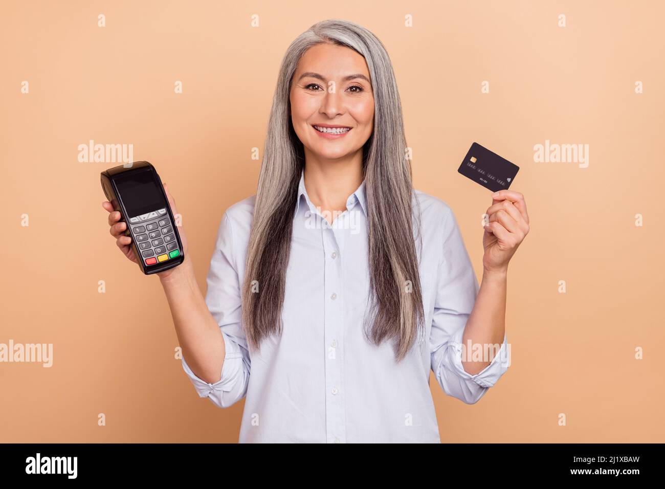 Photo of senior woman hold bank card store payment promo finance ...