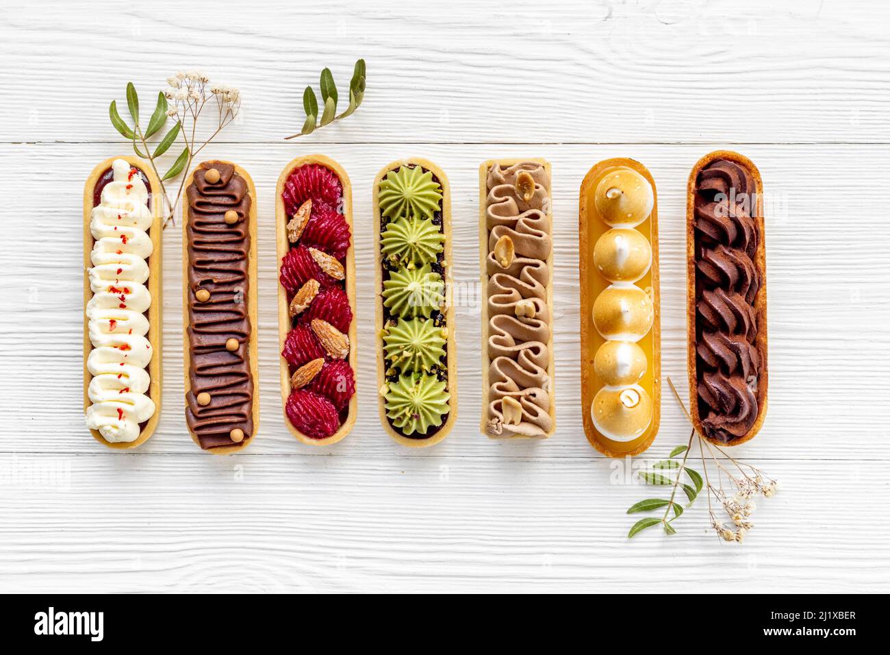 Sweet food pattern of eclairs with color topping. Sweet shacks Stock ...
