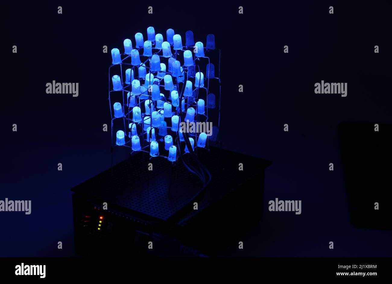 4x4x4 LED cube light displaying blue color lights on dark. Creative ...