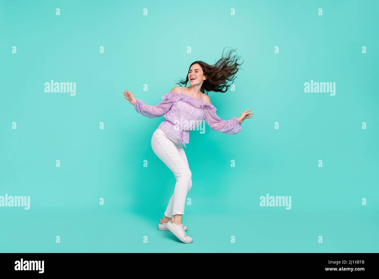 Full Length Body Size View Of Attractive Cheerful Dreamy Girl Dancing