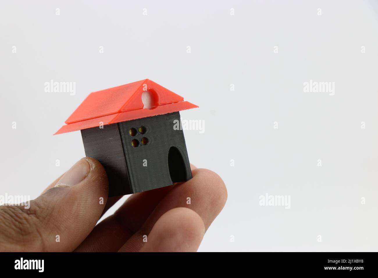 The model small house held in hand on white background, Miniature house ...