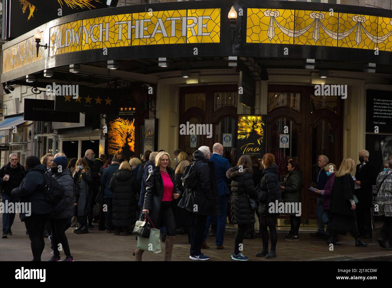 People queue outside the Aldwych Theatre in London after the relaxation ...