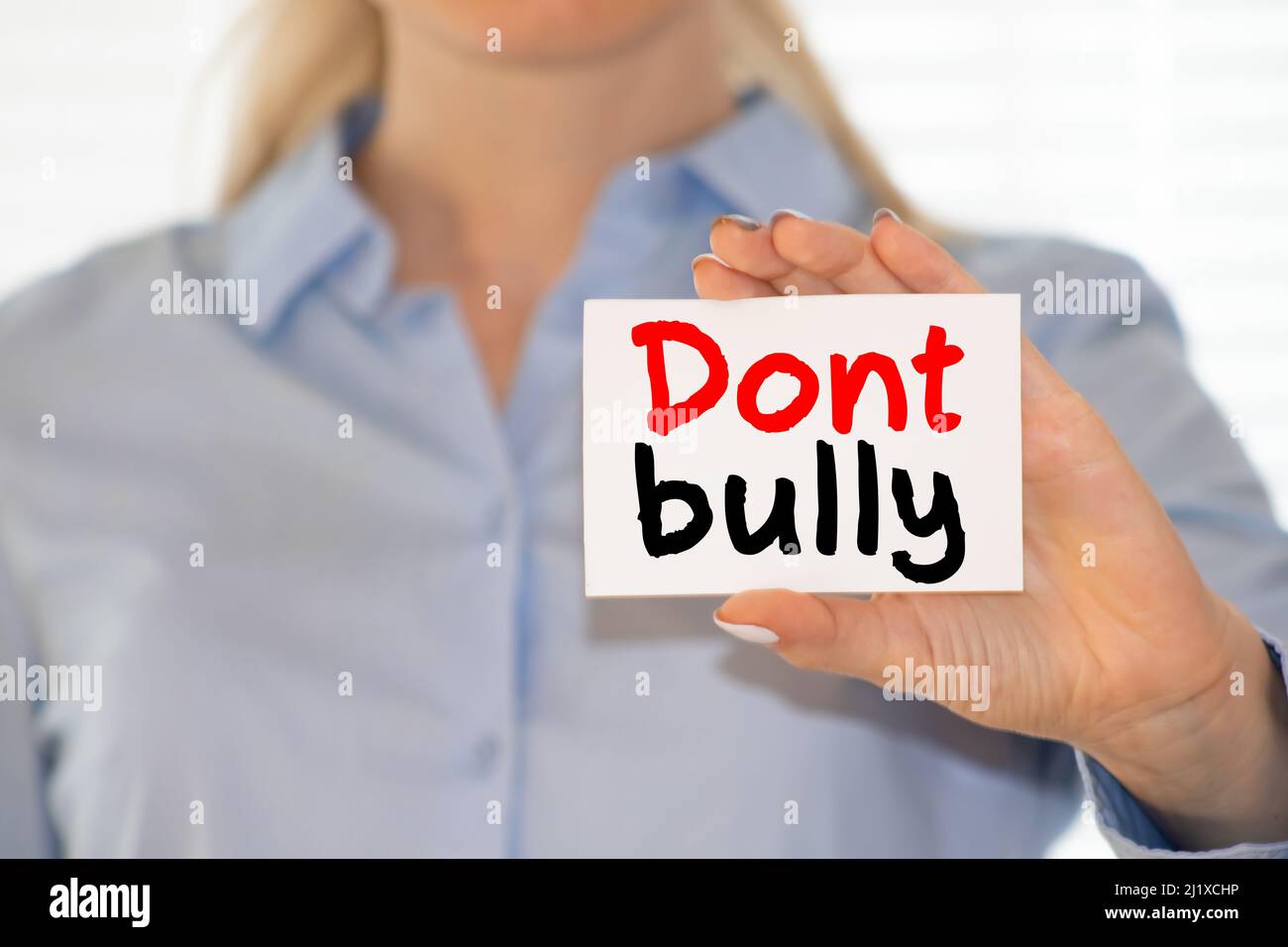 top view of wooden blocks with dont bully lettering on grey background ...