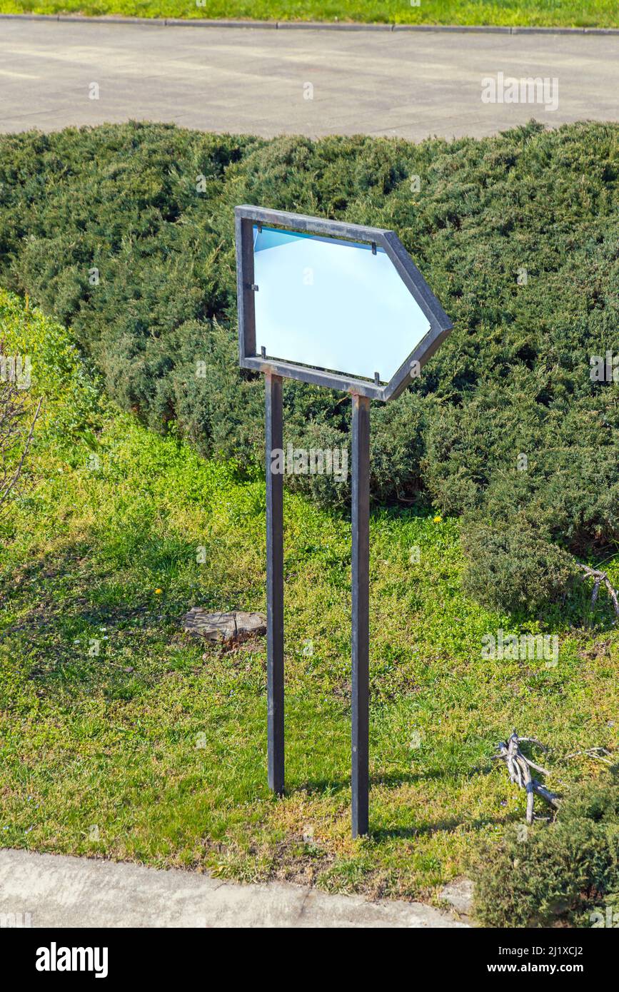 Directional Arrow Empty Sign Board in Green Park Stock Photo - Alamy