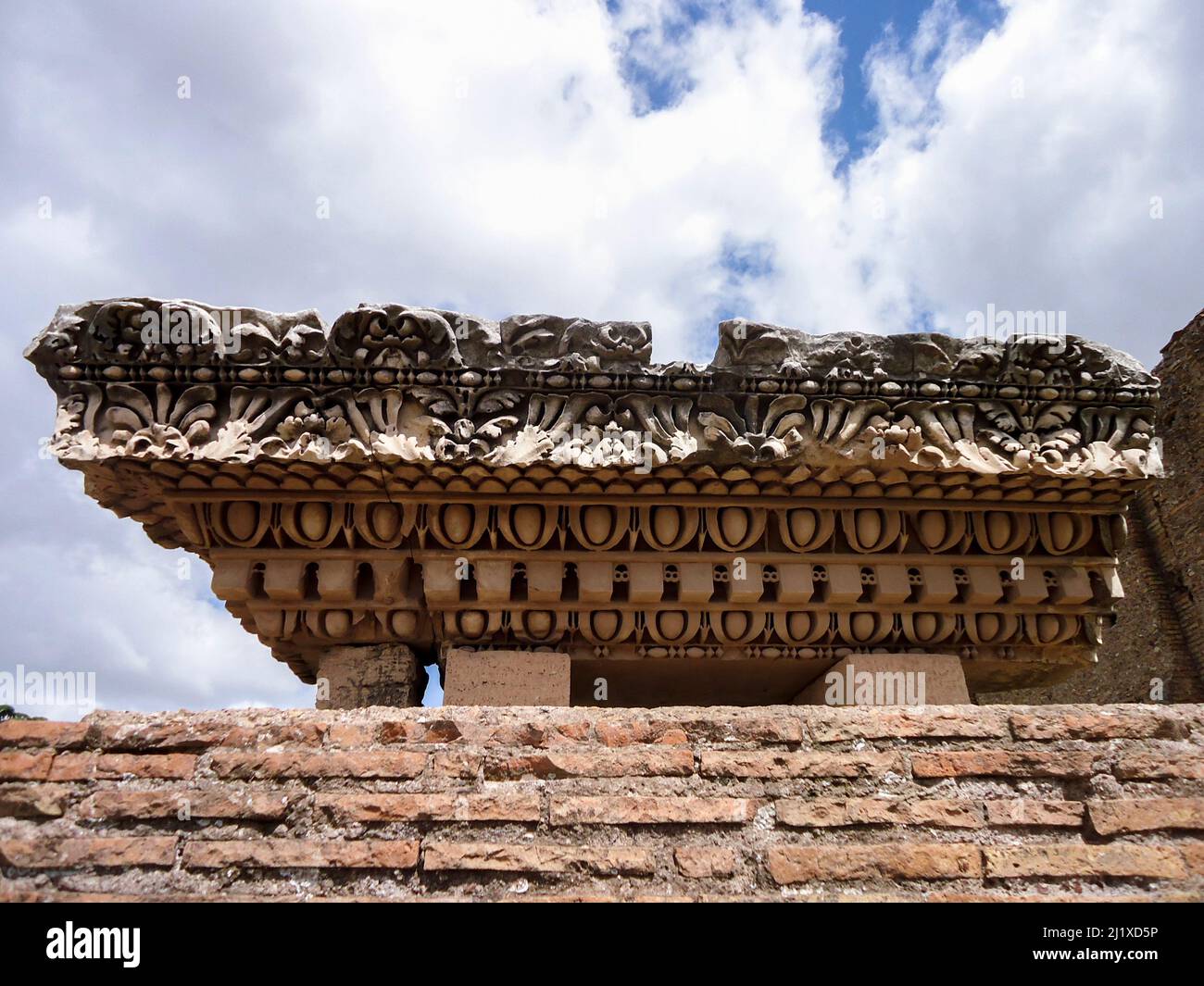 Ancient Roman Carved Stone Entablature In Archeological Ruins Stock ...