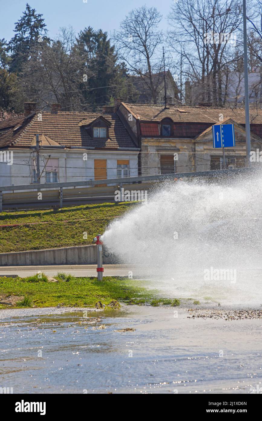 Broken Fire Hydrant Spraying Water at Street and Park Floods Stock ...