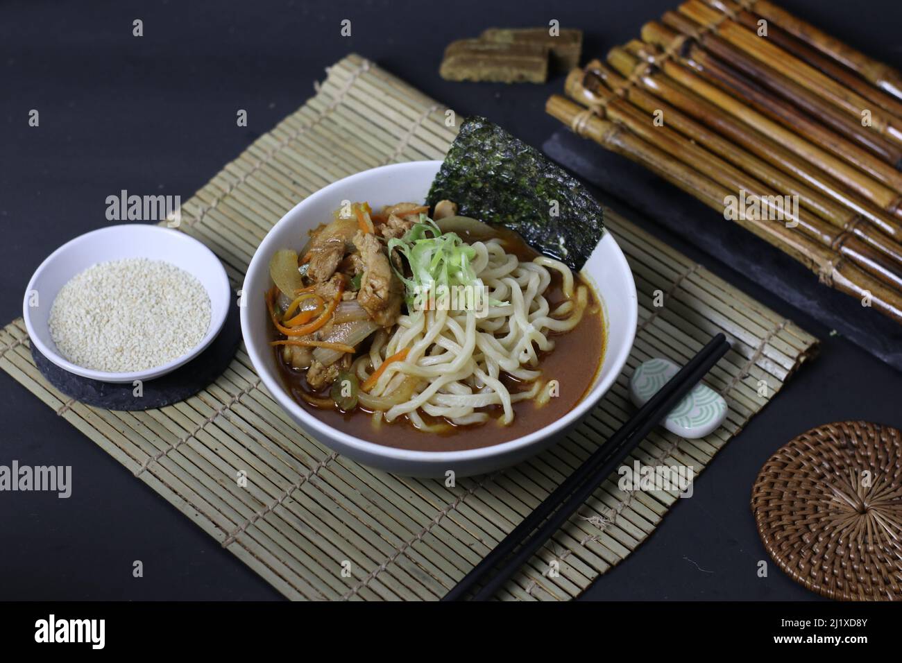 A top view of a delicious Japanese ramen served with sticks in a ...