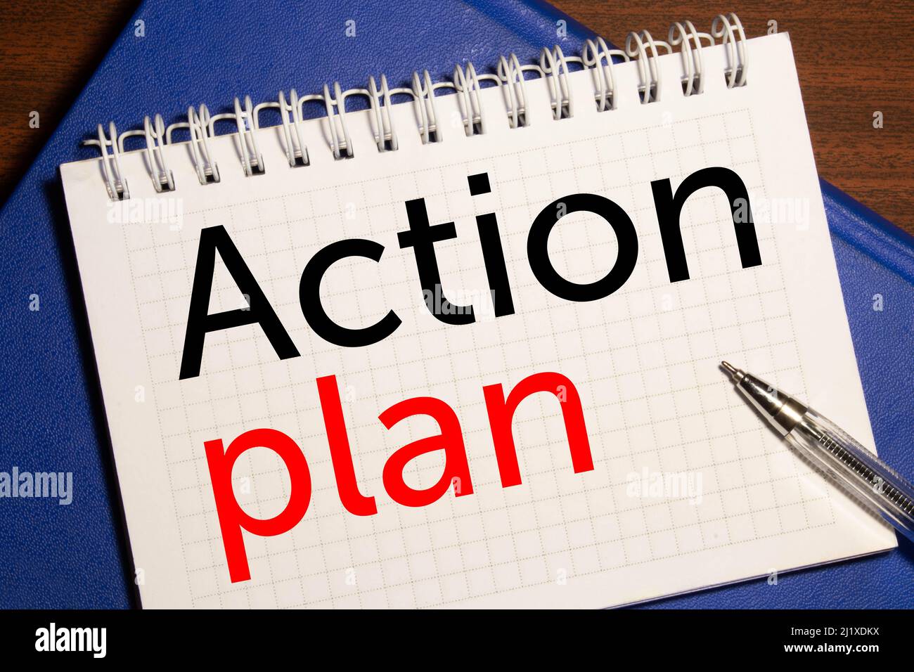 Action plan memo written on a notebook with pen Stock Photo - Alamy