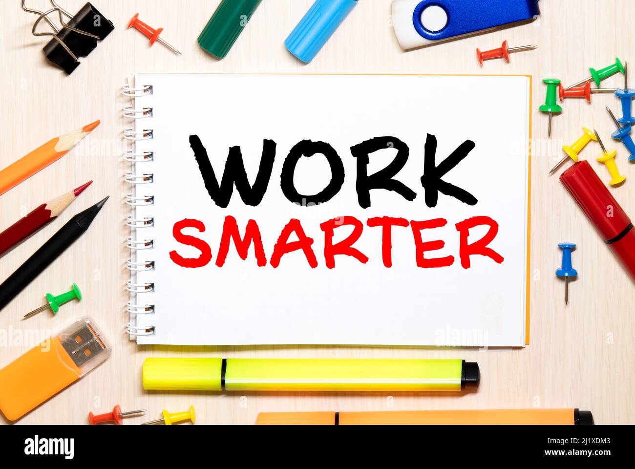 Notebook on table with text inside: Work Smart Stock Photo - Alamy