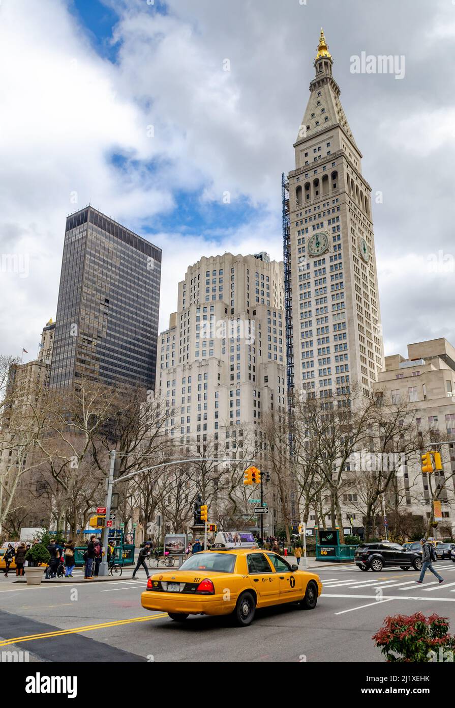 Met Life Tower during daylight, New York City with yellow taxi cab in ...
