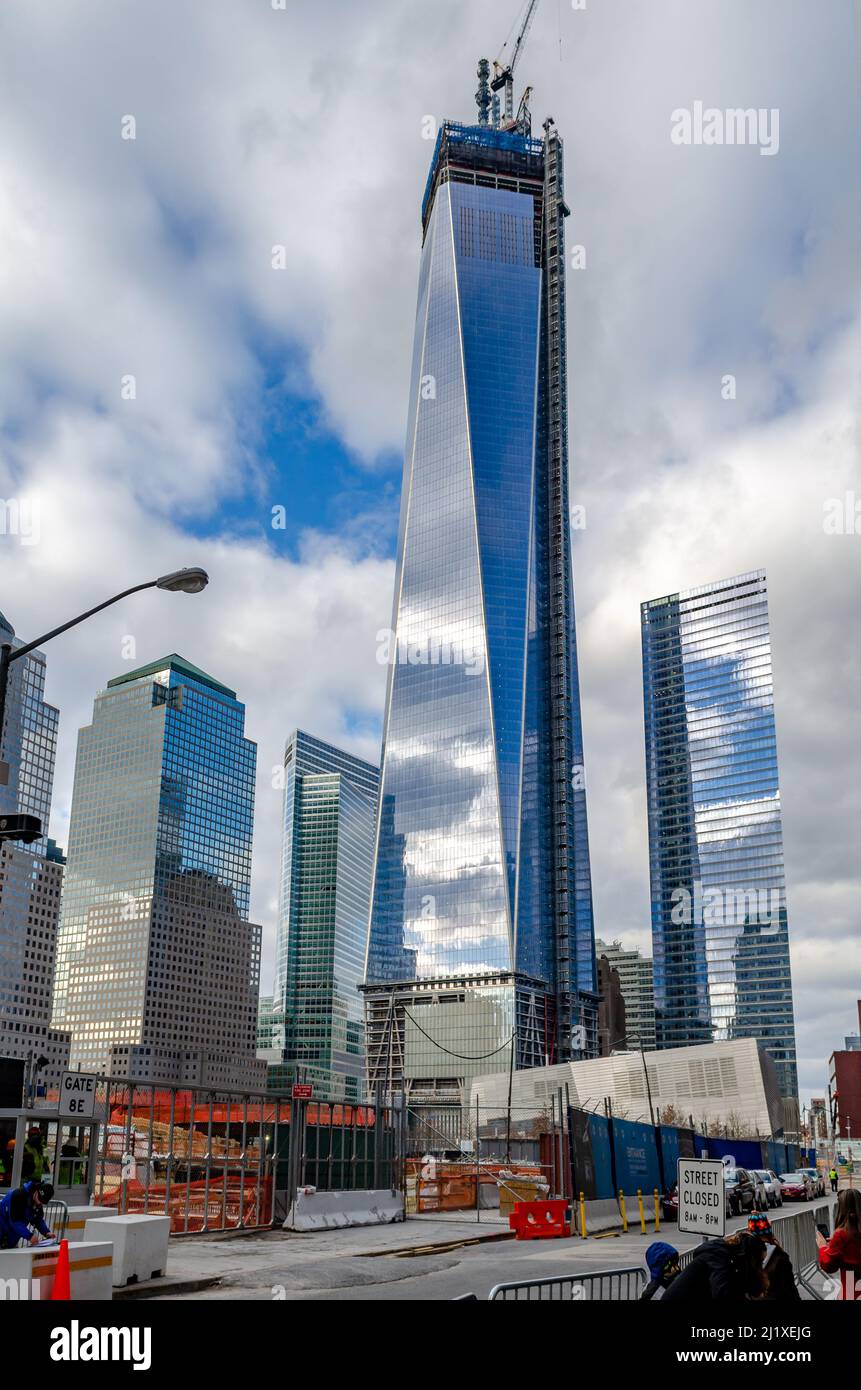 One World Trade Center construction area with clouds reflection in the ...