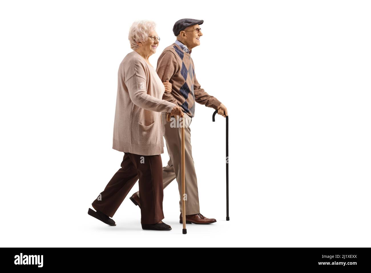 Two elderly people walking canes hi-res stock photography and images ...