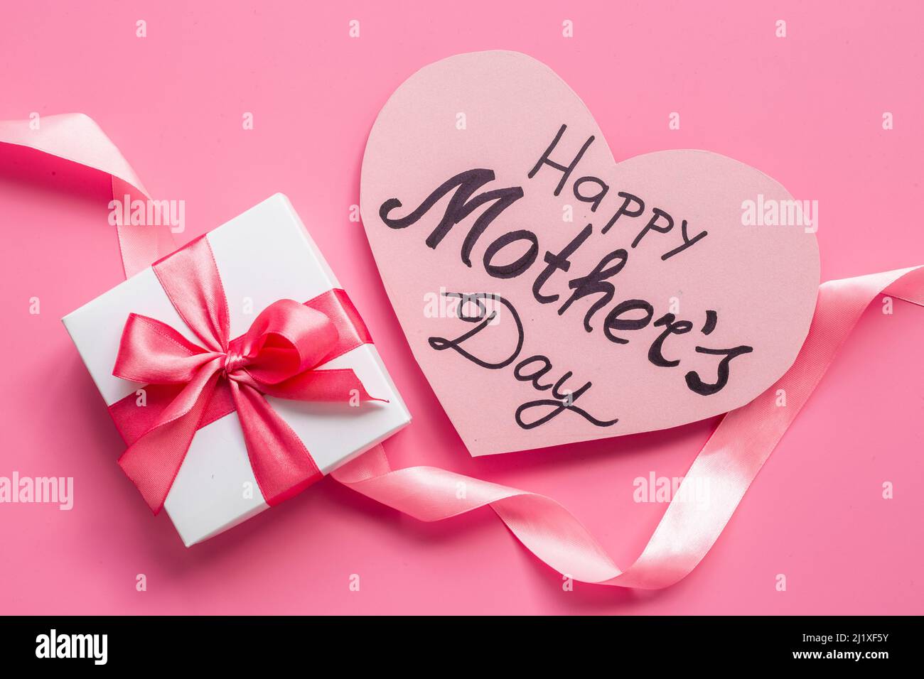 Women mothers day concept with pink ribbon fift box Stock Photo - Alamy