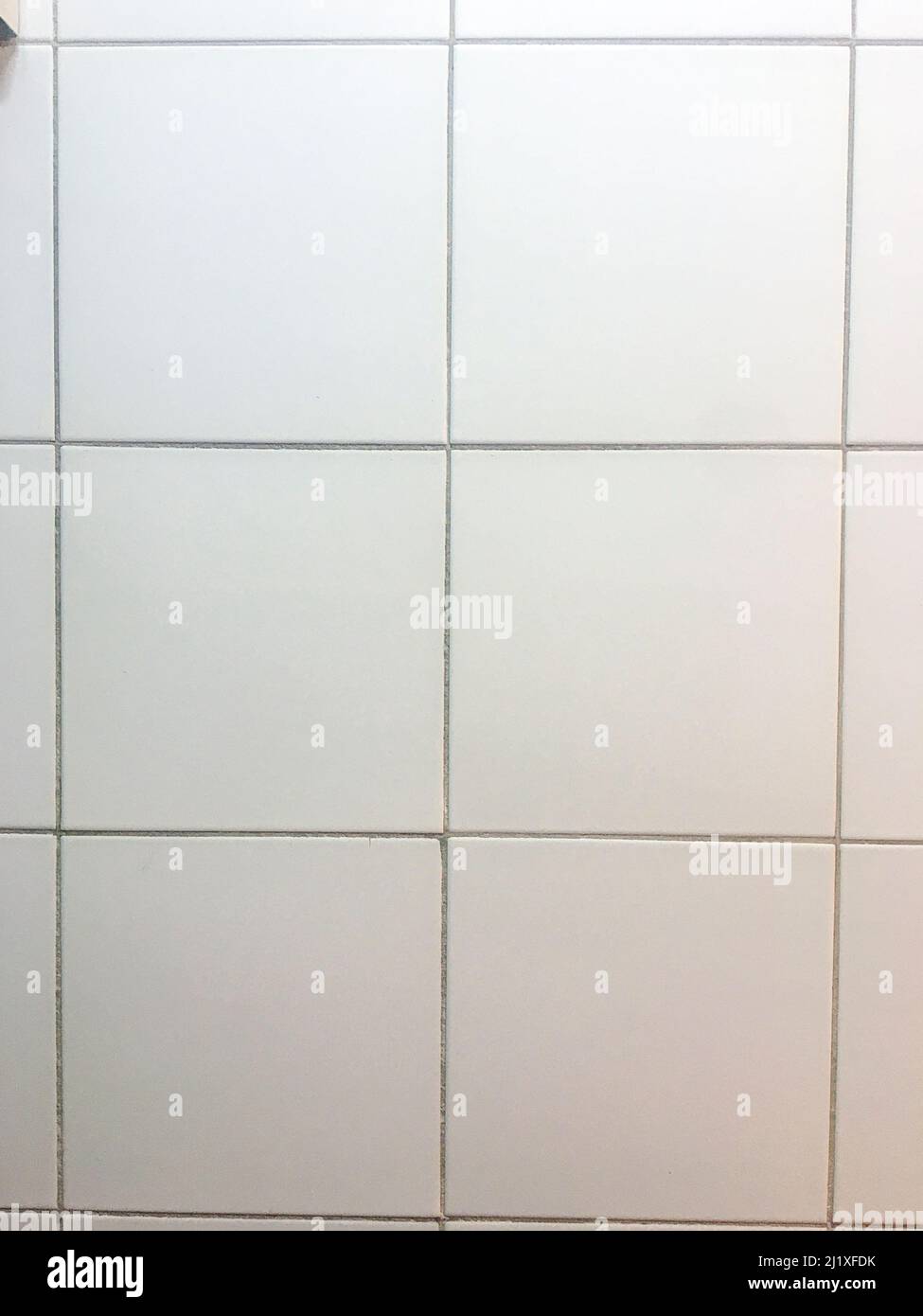 White bathroom with white rectangular tiles hi-res stock photography ...