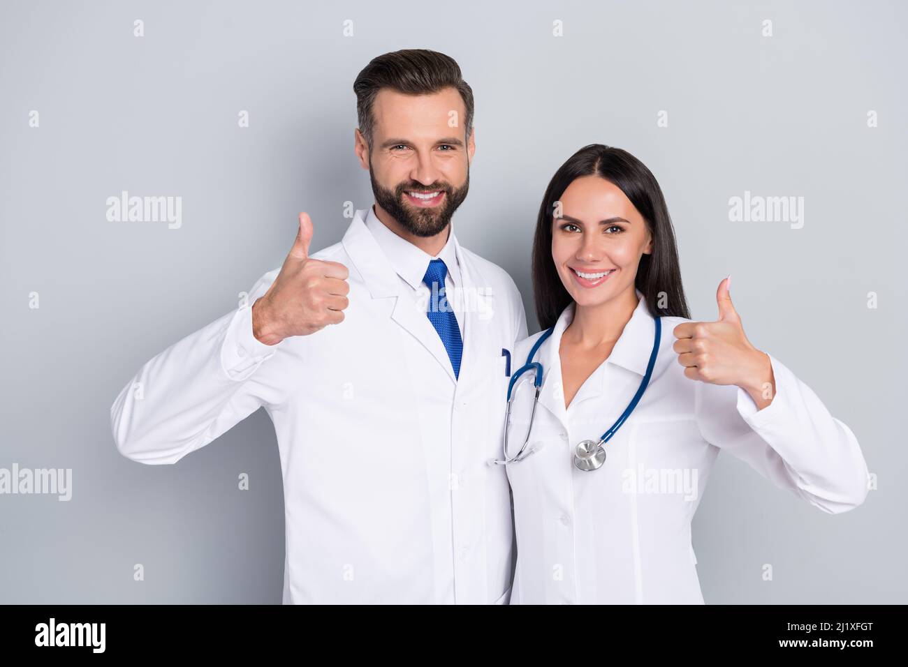 Photo of smart happy two docs dressed white coats embracing showing ...