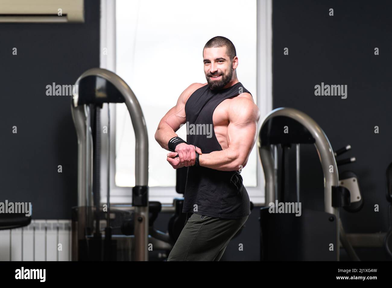 Portrait Of A Young Physically Fit Man Showing His Well Trained Body ...