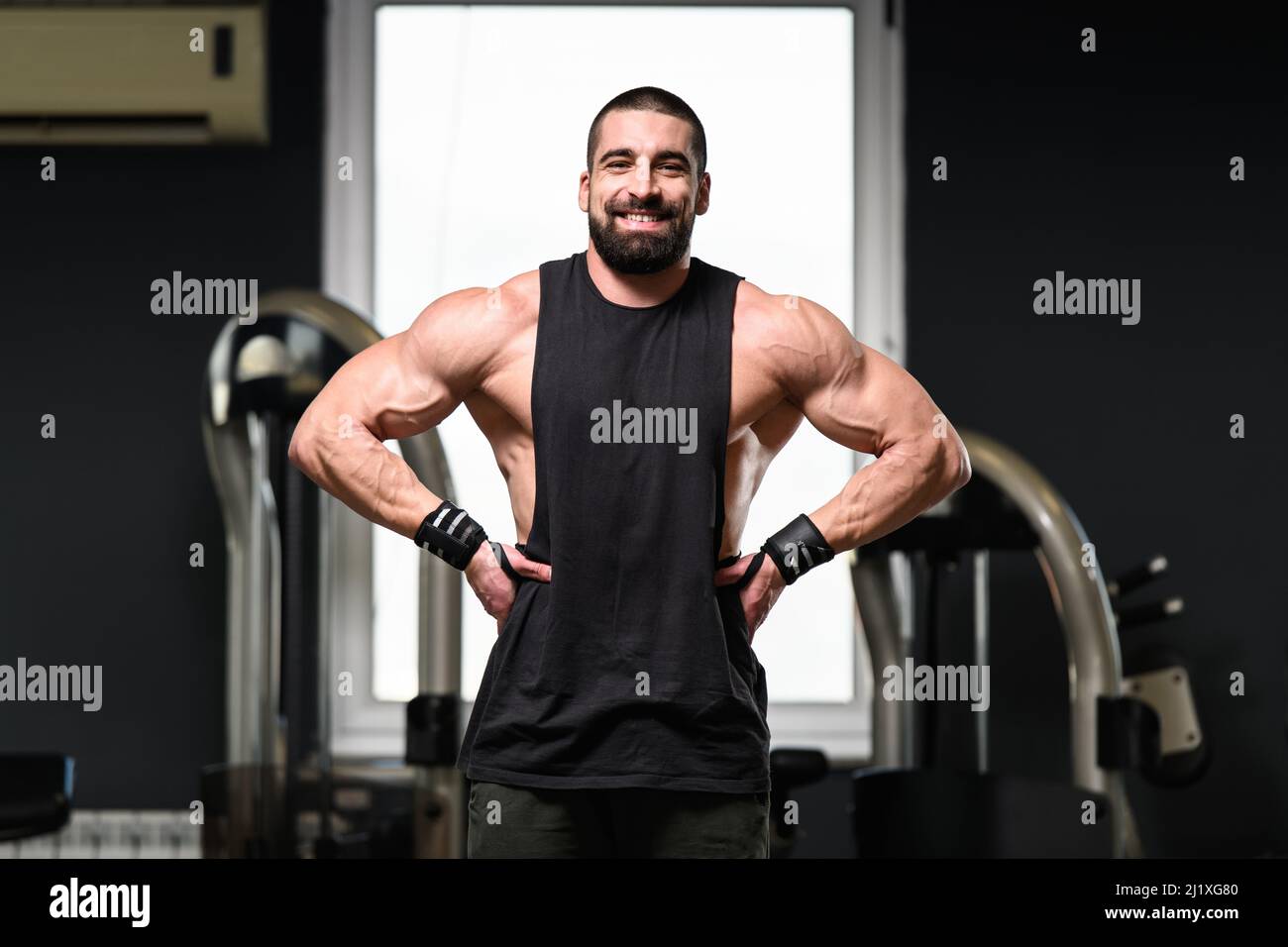 Portrait Of A Young Physically Fit Man Showing His Well Trained Body ...