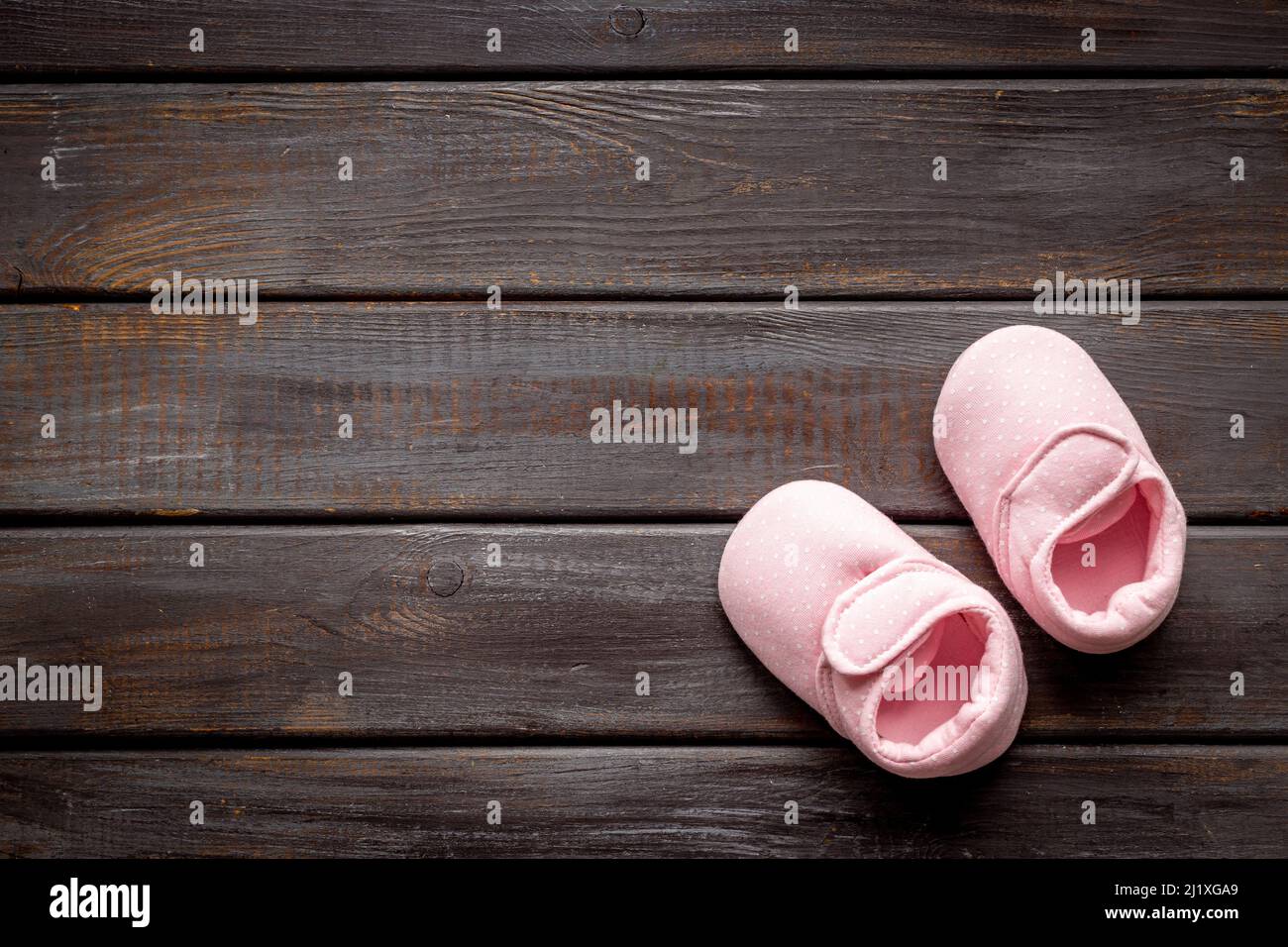 Baby girl pink newborn booties - babyshower party background Stock ...