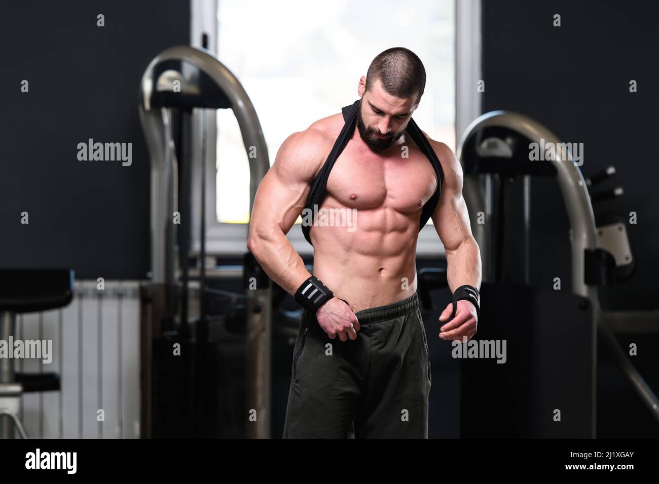 Portrait Of A Young Physically Fit Man Showing His Well Trained Body ...